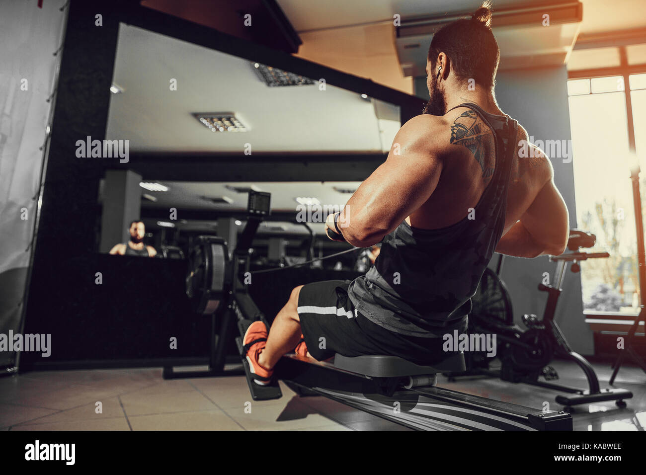Young guy training using machine hi-res stock photography and images ...