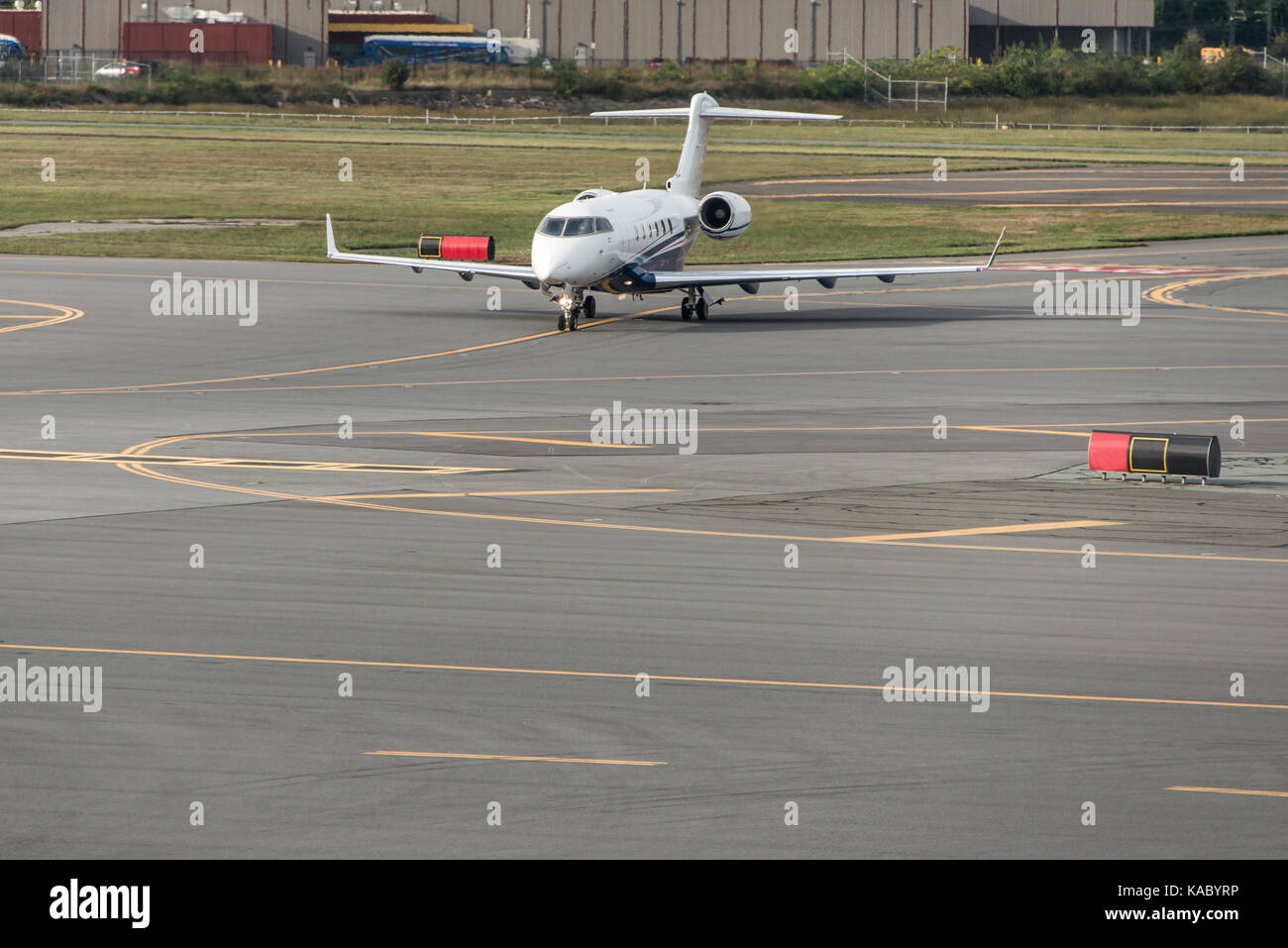 business jet airplane or aircraft with open door on airfield near of ...