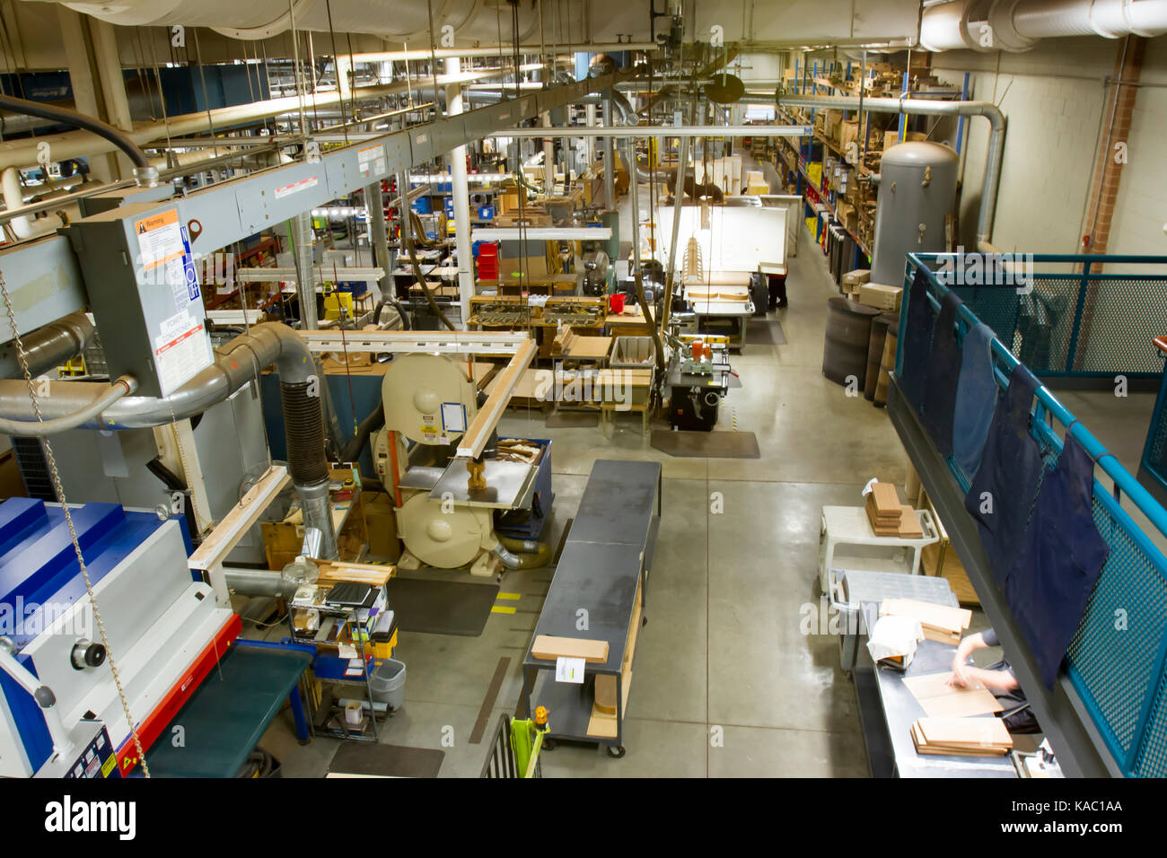 Heavy equipment and workstations on floor of modern factory Stock Photo ...