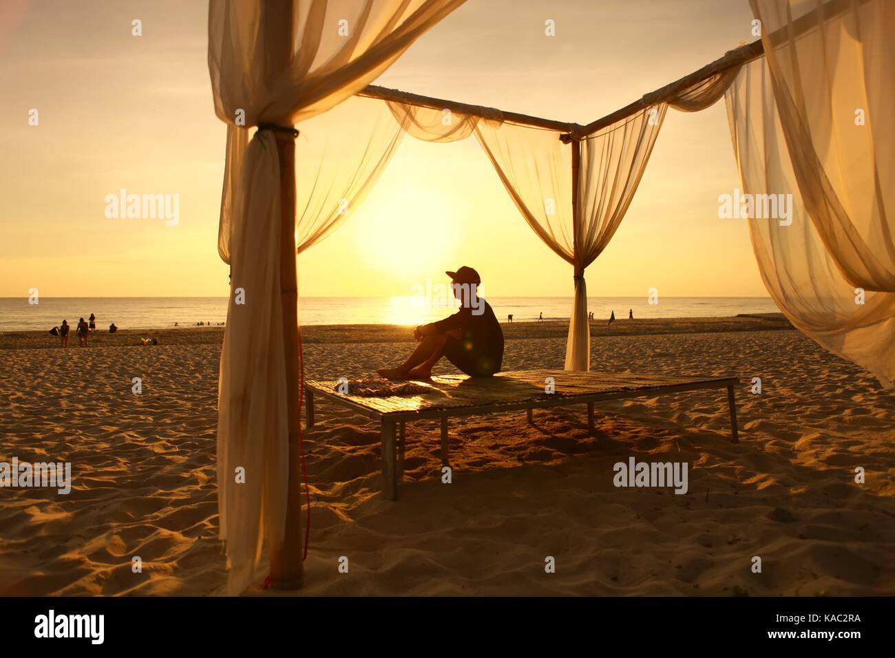 Man sunbathing on the beach hi-res stock photography and images - Alamy