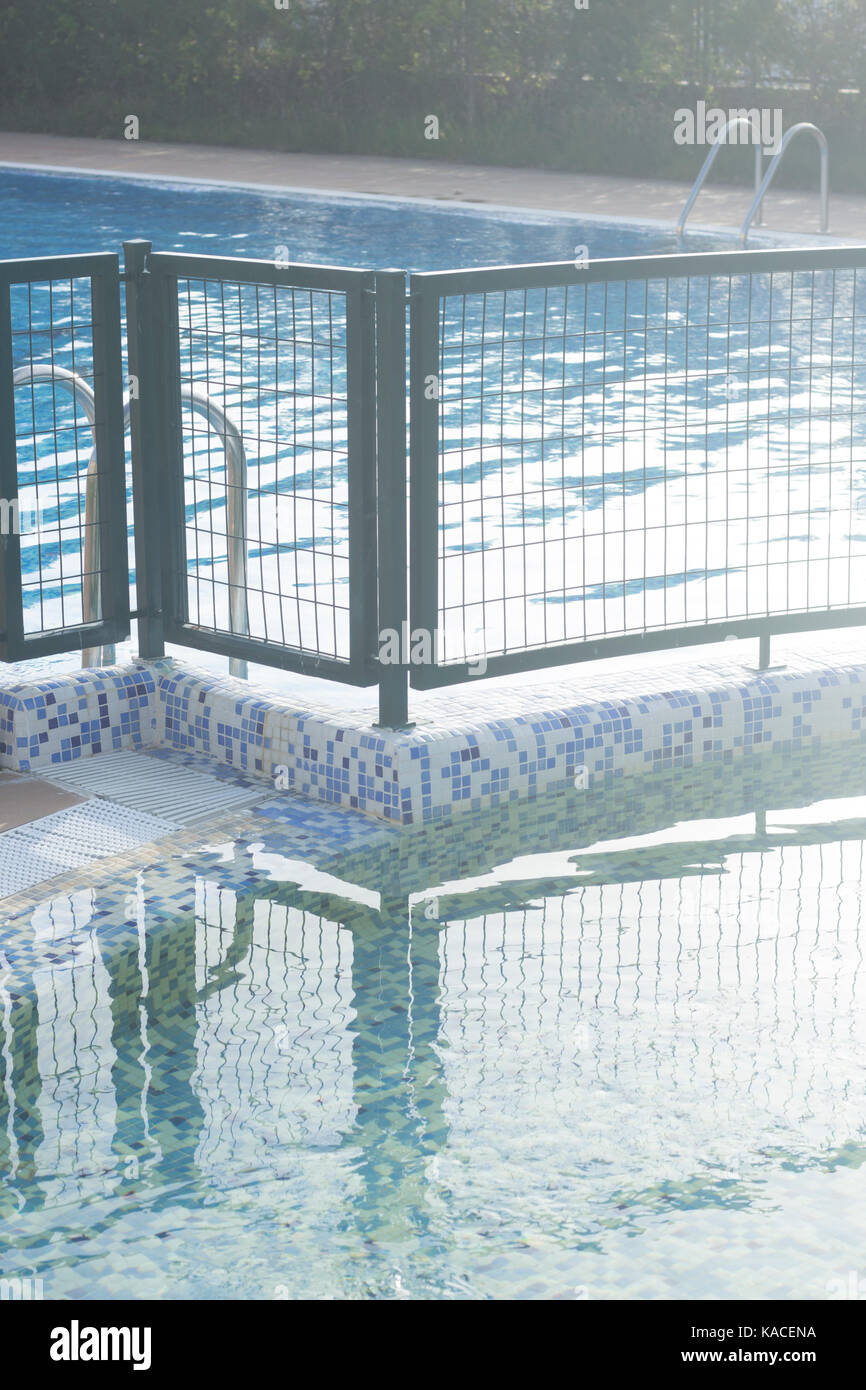 Blue swimming pool on hot sunny day on summer vacation Stock Photo - Alamy