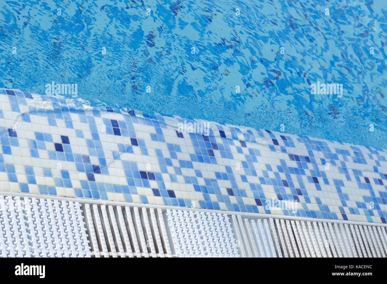 Blue swimming pool on hot sunny day on summer vacation Stock Photo - Alamy