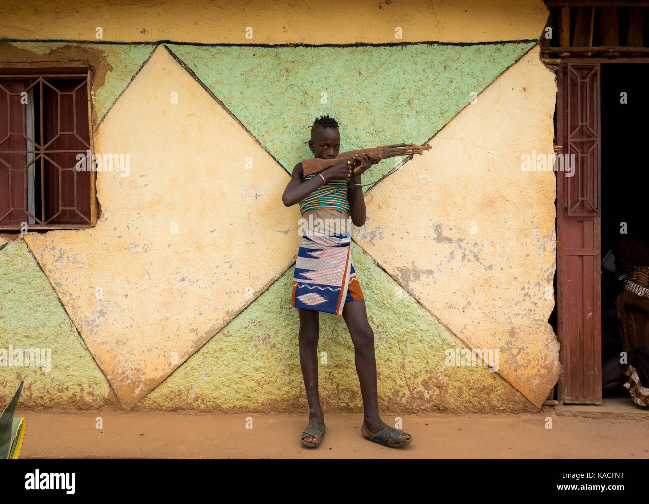 Hamer tribe boy with a fake wooden gun, Dimeka, Omo valley, Ethiopia ...