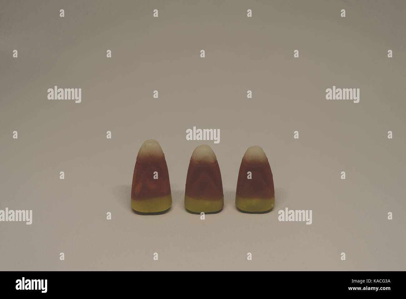Three Standing Candy Corn Pieces Stock Photo - Alamy