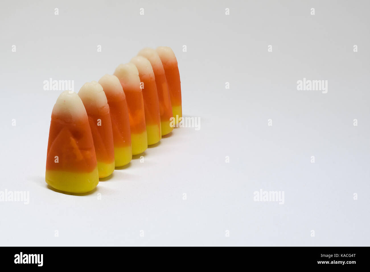 Bright Row of Slanted Standing Candy Corn Stock Photo - Alamy
