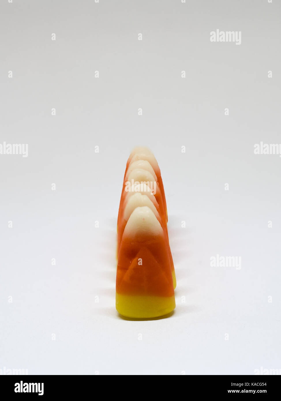 Bright Candy Corn Standing in a Row Stock Photo - Alamy