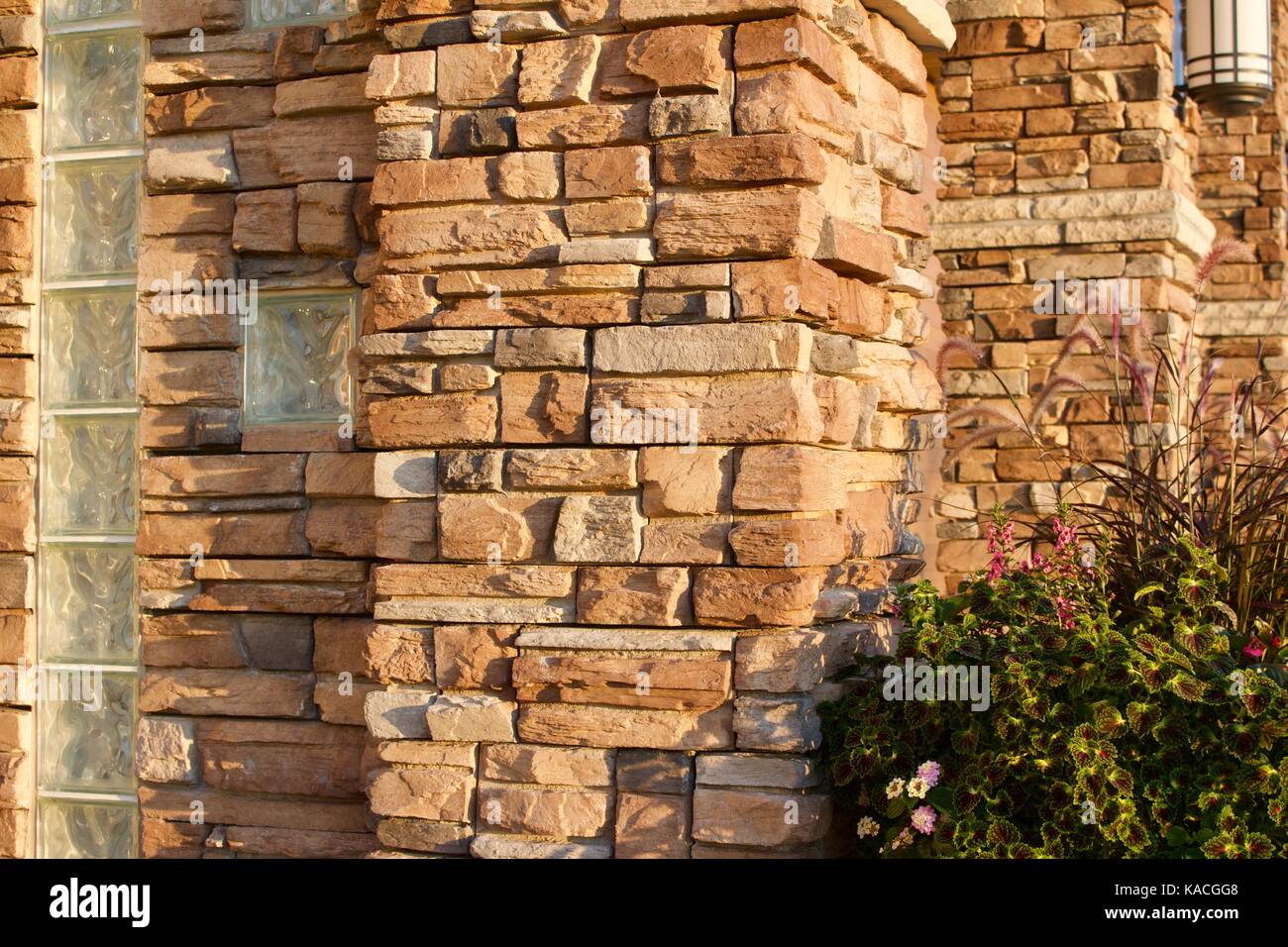 Beautiful sun illuminated limestone brick corner wall accented with ...