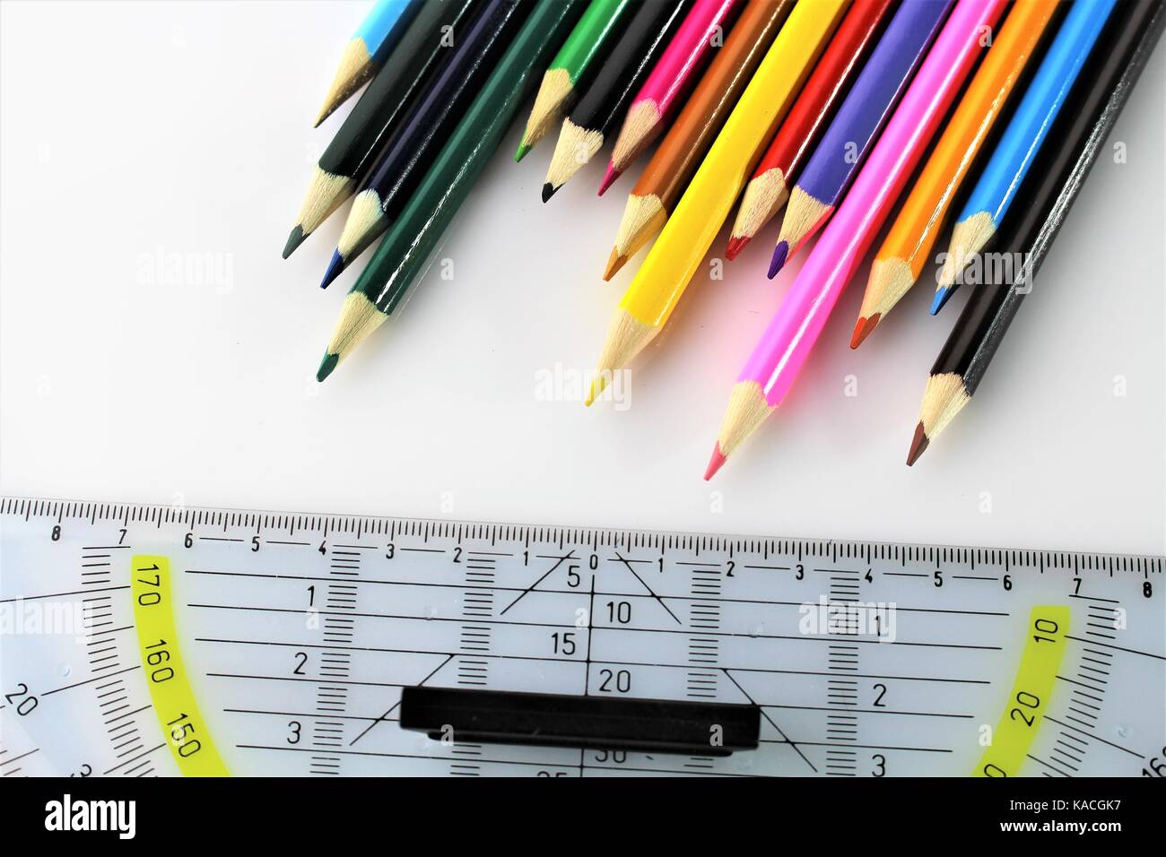 An image of a triangle ruler and a pen - office, school Stock Photo - Alamy