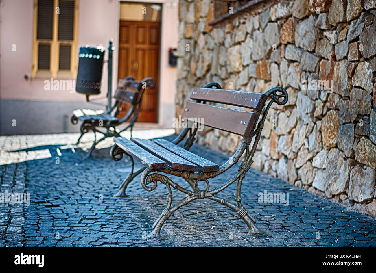 closeup of bench in a alley in sunny day Stock Photo - Alamy