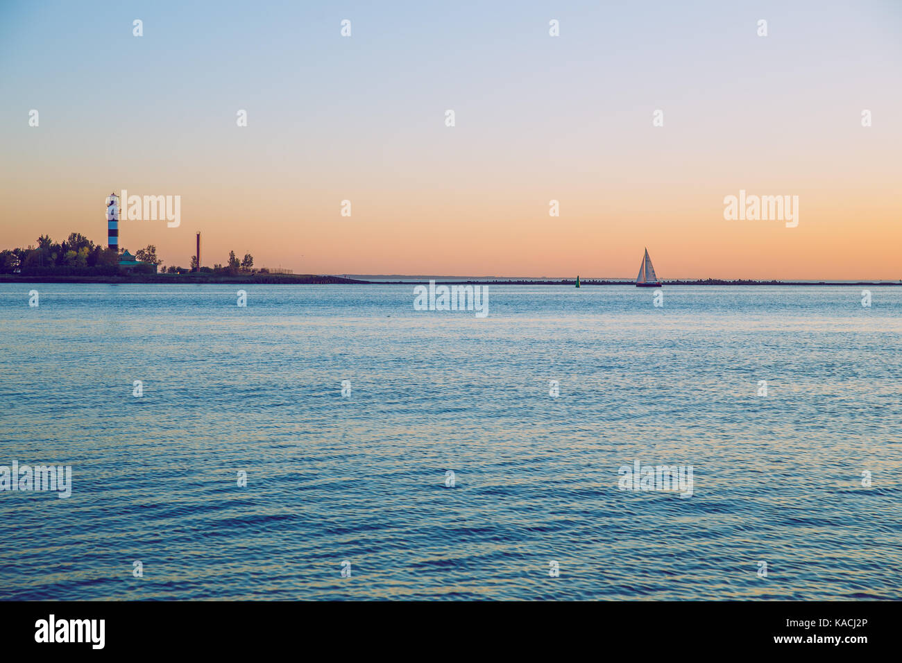 Latvia, Riga, Baltic sea, sunset, mole and wave, yacht. 2017 Stock ...