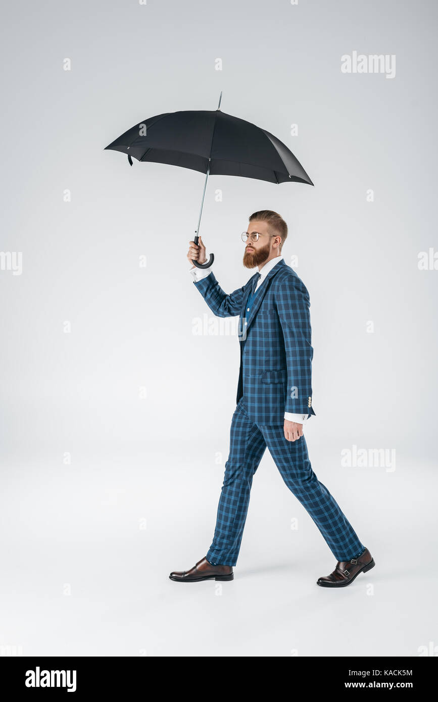 attractive young man with umbrella Stock Photo - Alamy