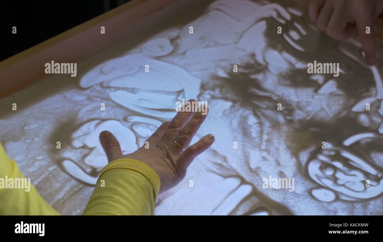 Sand painting. Abstract hand made background. Sand animation. Womans ...