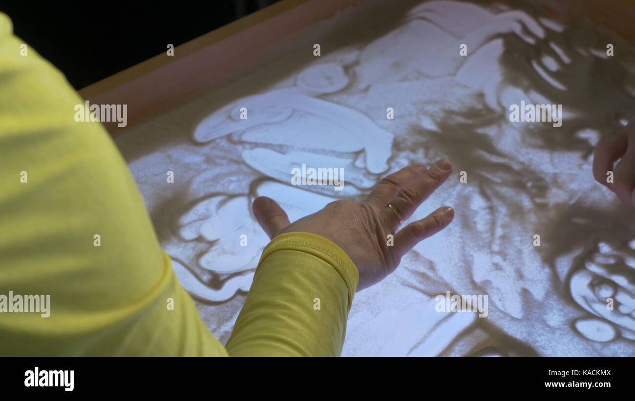 Sand painting. Abstract hand made background. Sand animation. Womans ...