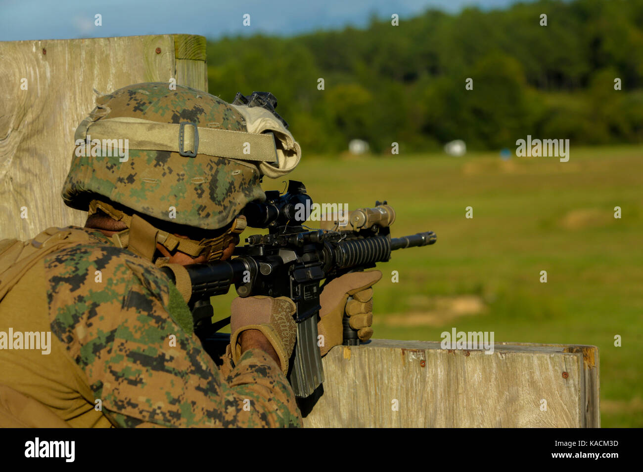 A Marine with 2nd Light Armored Reconnaissance Battalion aims at ...
