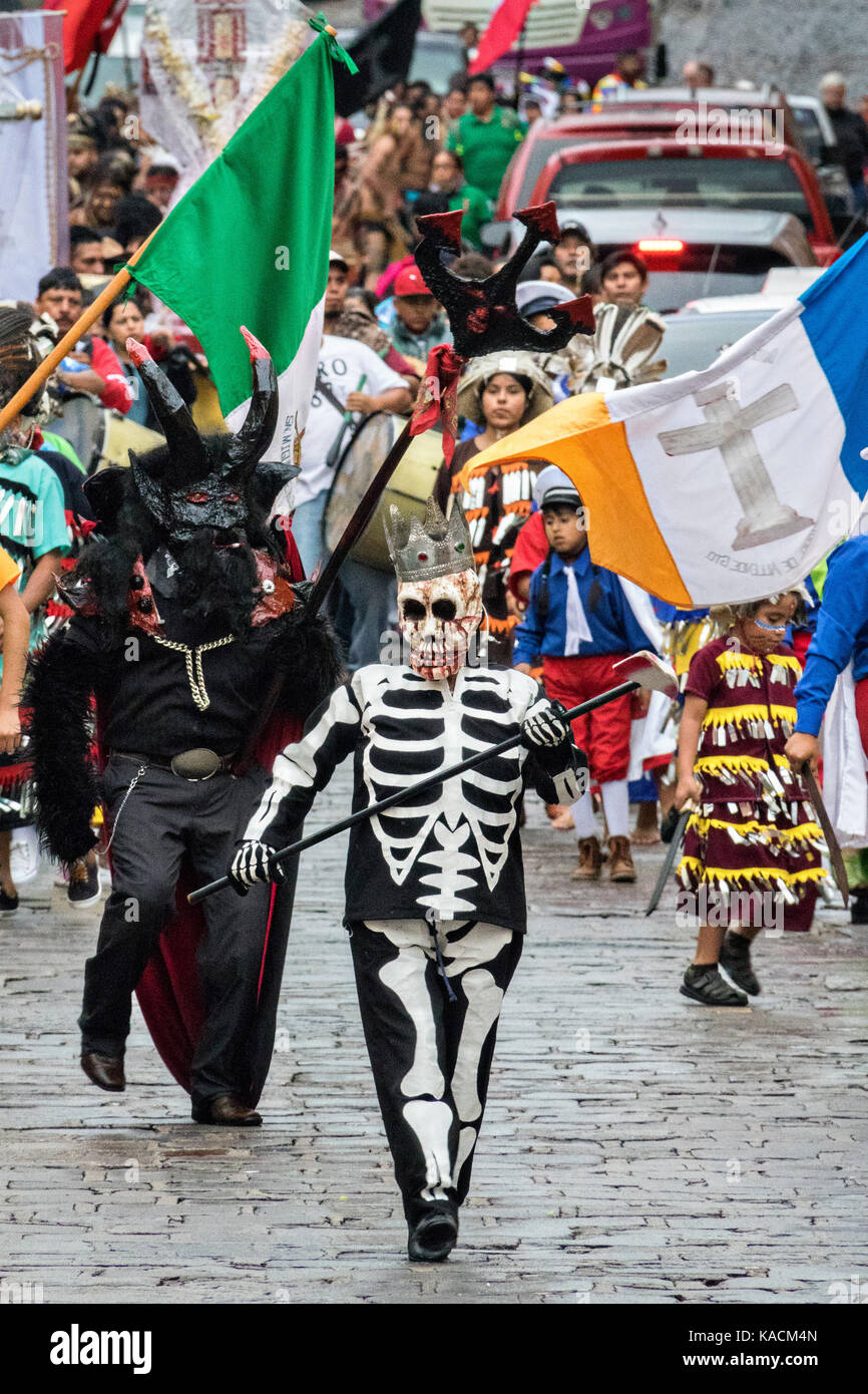 The skeleton king leads a procession through the historic city during ...