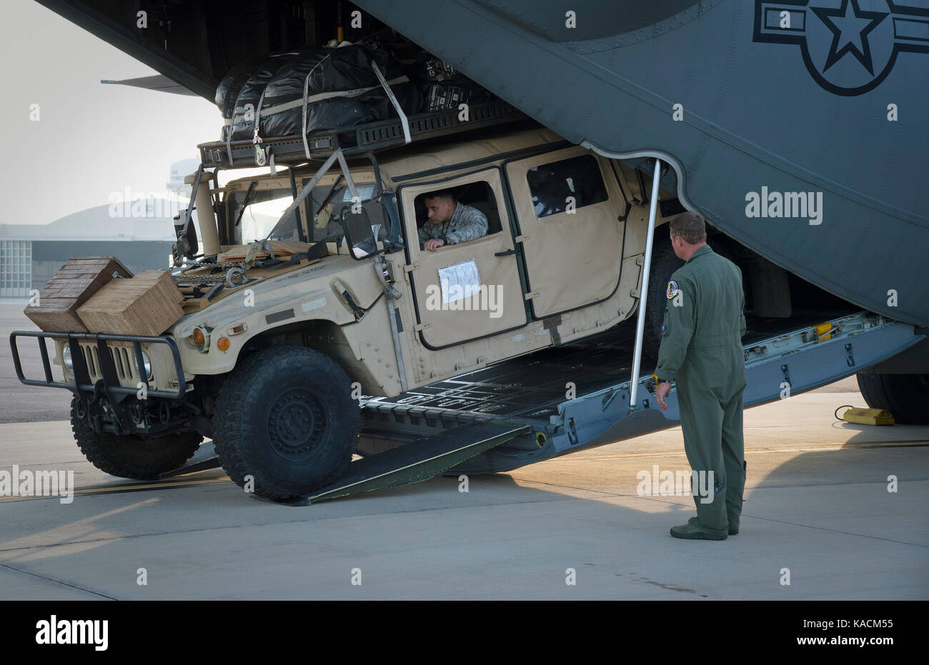 Humvees are delivered by C-130 Hercules Stock Photo - Alamy