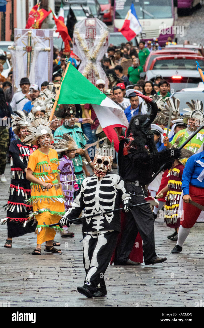 The skeleton king leads a procession through the historic city during ...