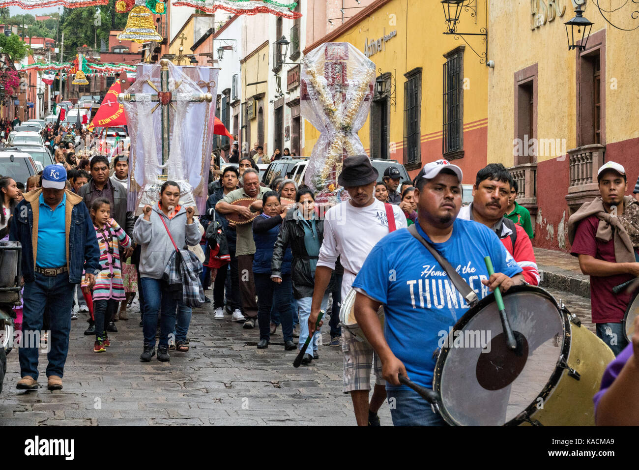 Residents carry crosses and religious icons in a procession through the ...