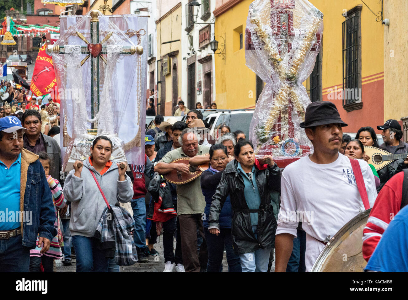 Residents carry crosses and religious icons in a procession through the ...