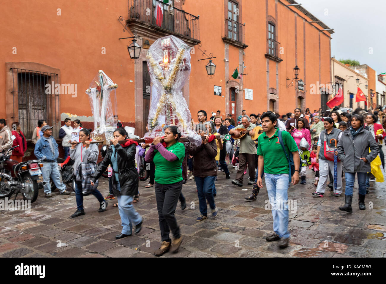 Residents carry crosses and religious icons in a procession through the ...