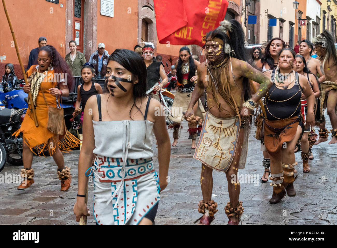 Aztec indians dance in a procession through the historic city during ...
