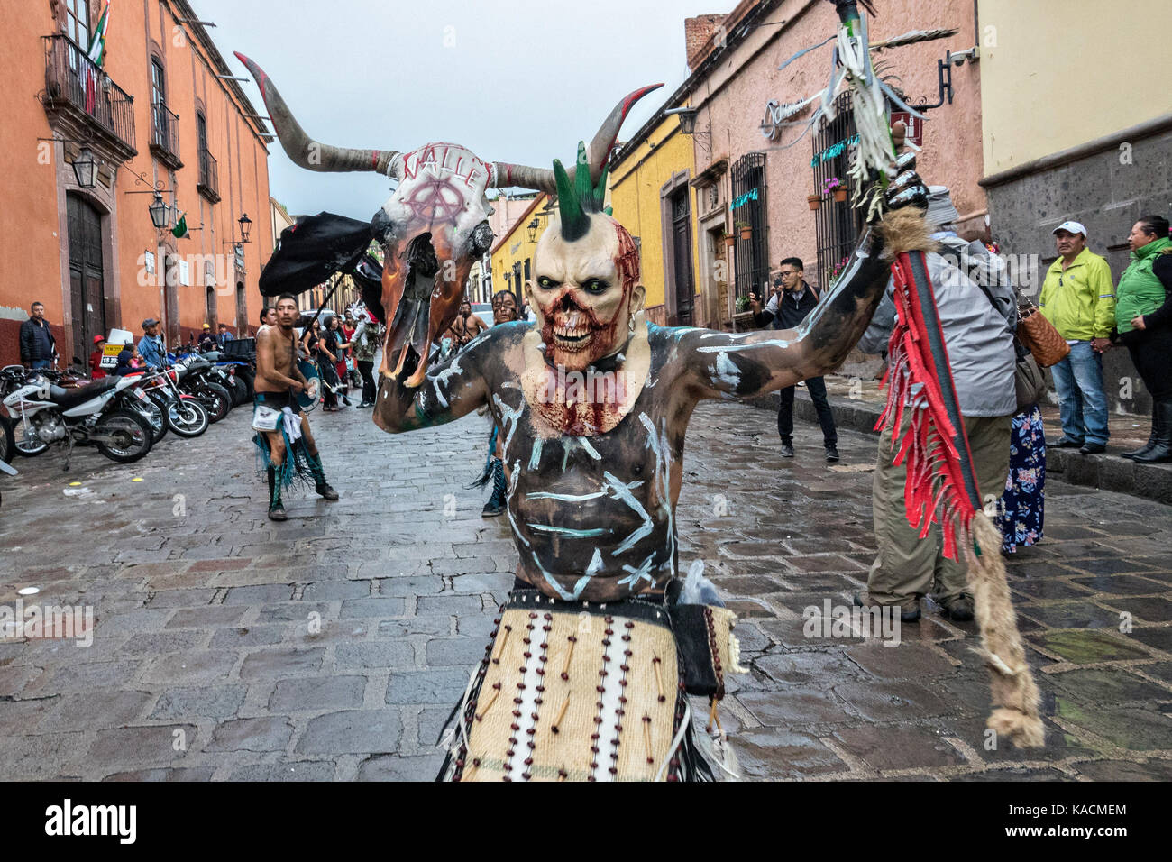 Aztec indians dance in a procession through the historic city during ...