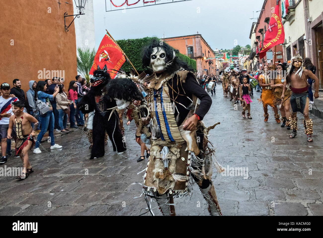 Aztec indians dance in a procession through the historic city during ...