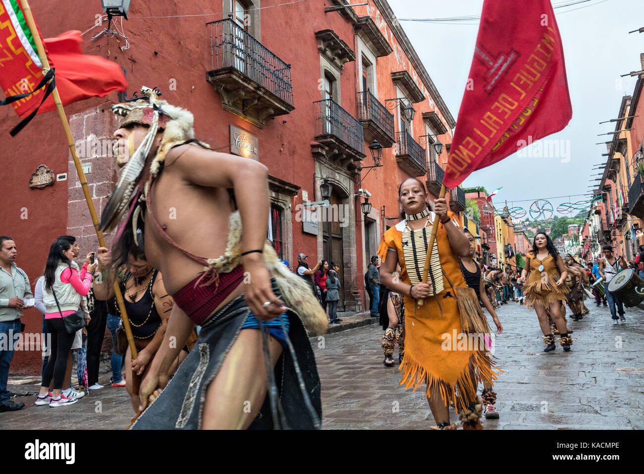Aztec indians dance in a procession through the historic city during ...