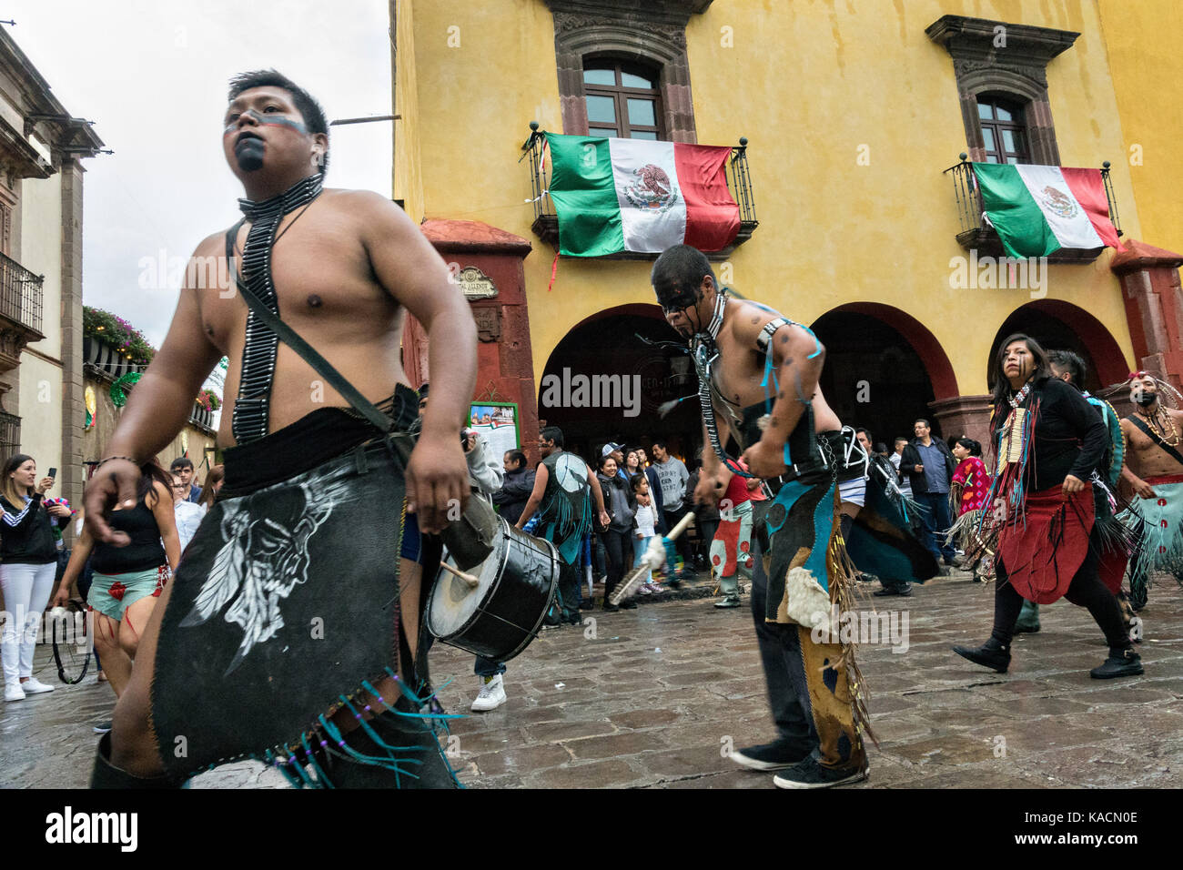 Aztec Indians dance in a procession through the Jardin Allende during ...