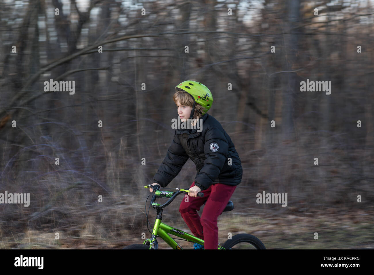 Boy riding his bicycle hi-res stock photography and images - Alamy