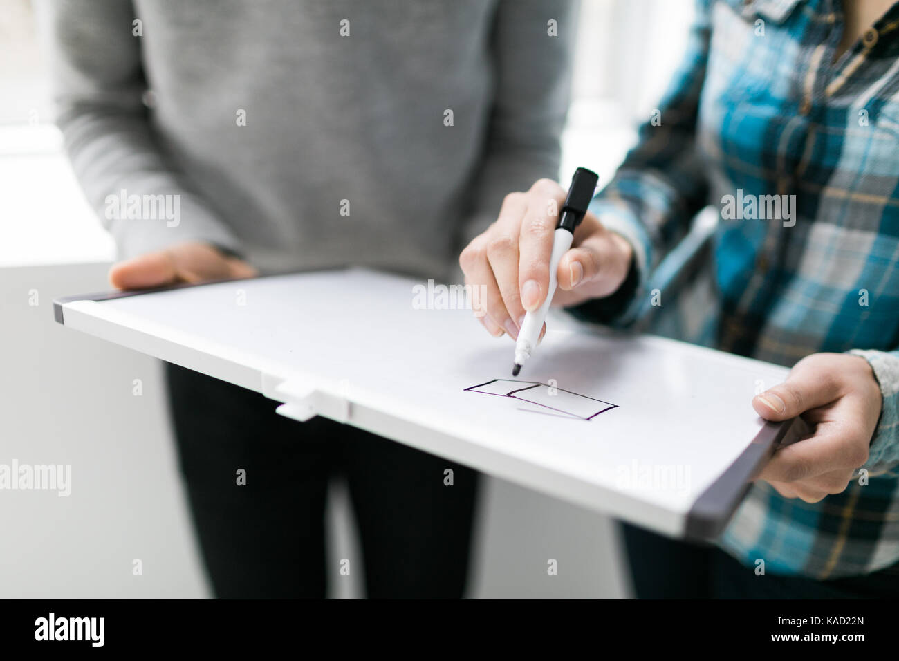 Young business people working on a project Stock Photo - Alamy