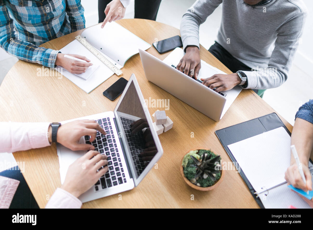 Collaborating male coworker typing hi-res stock photography and images ...