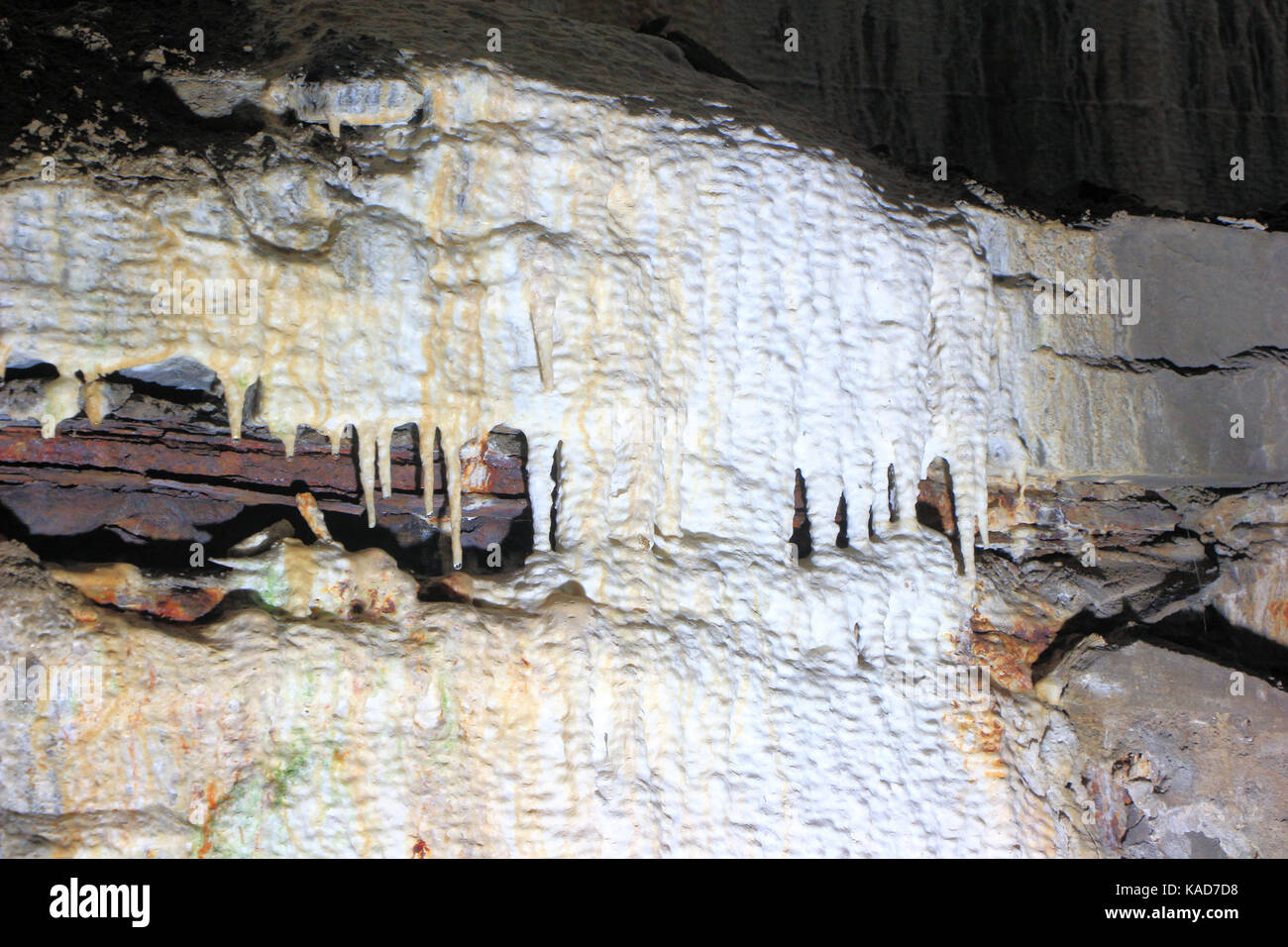 Salt and limes leaching from concrete forms a frozen waterfall in ...