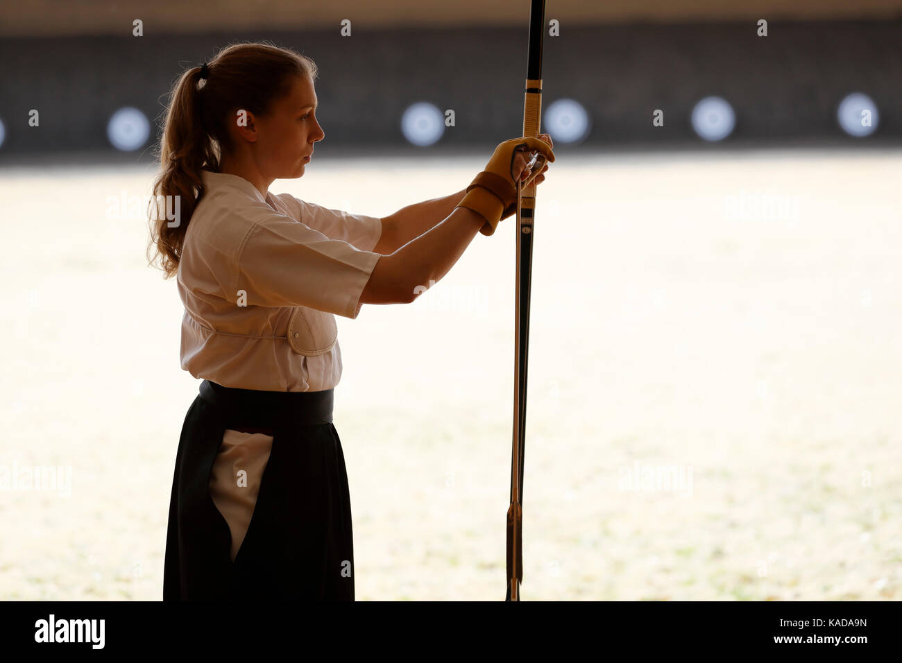 Caucasian woman practicing traditional Kyudo Japanese archery Stock ...