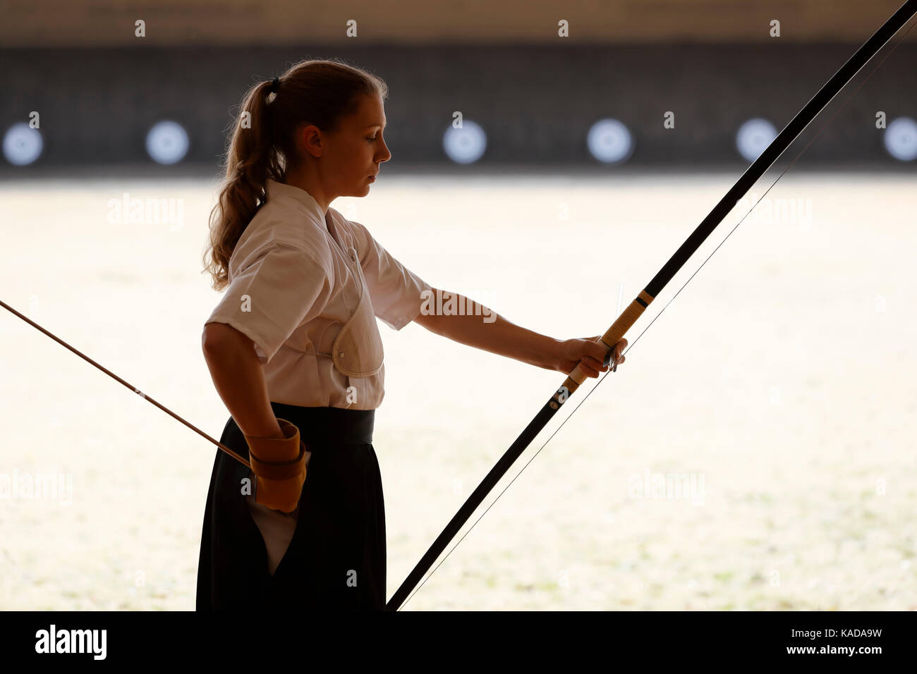 Caucasian woman practicing traditional Kyudo Japanese archery Stock ...