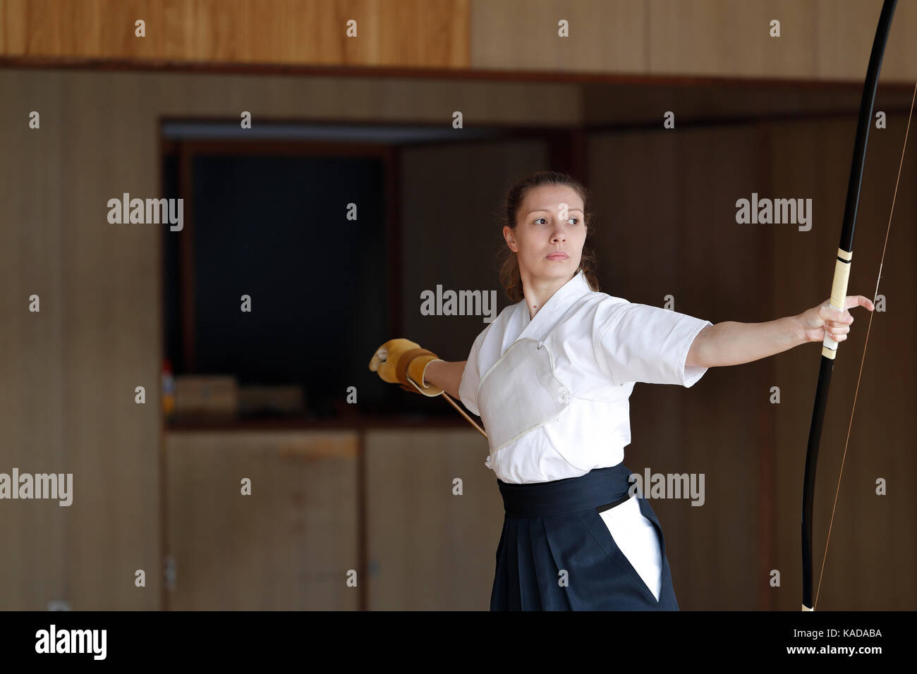 Caucasian woman practicing traditional Kyudo Japanese archery Stock ...