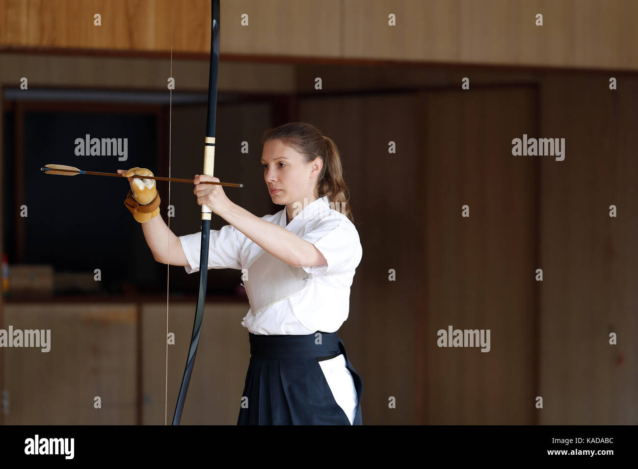 Caucasian woman practicing traditional Kyudo Japanese archery Stock ...