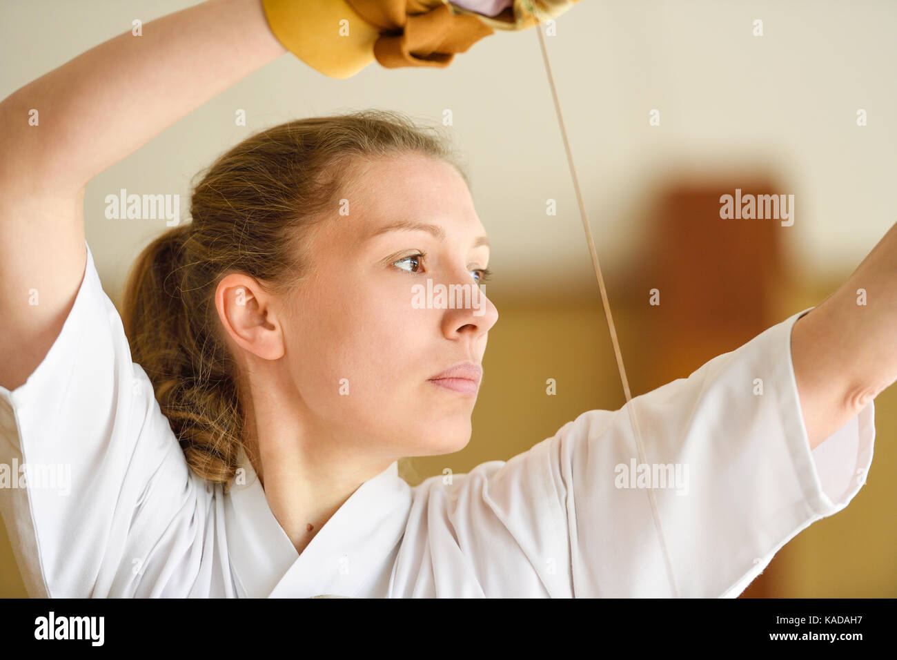 Caucasian woman practicing traditional Kyudo Japanese archery Stock ...