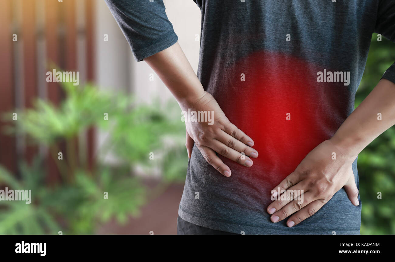 young man Feeling suffering Lower back pain Pain relief concept Stock ...