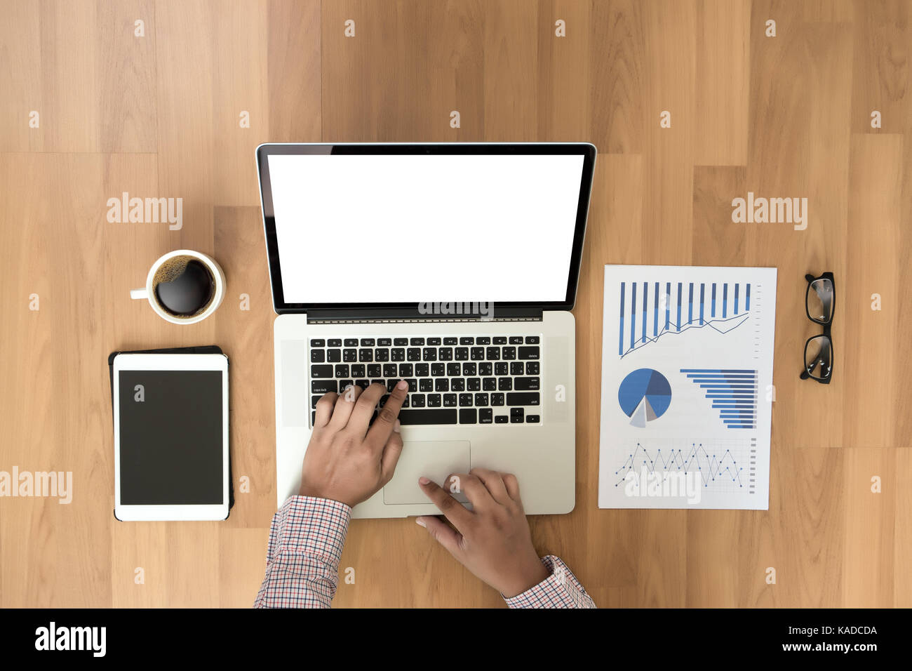 Top view man used of laptop hands on a wooden desktop and copy space ...
