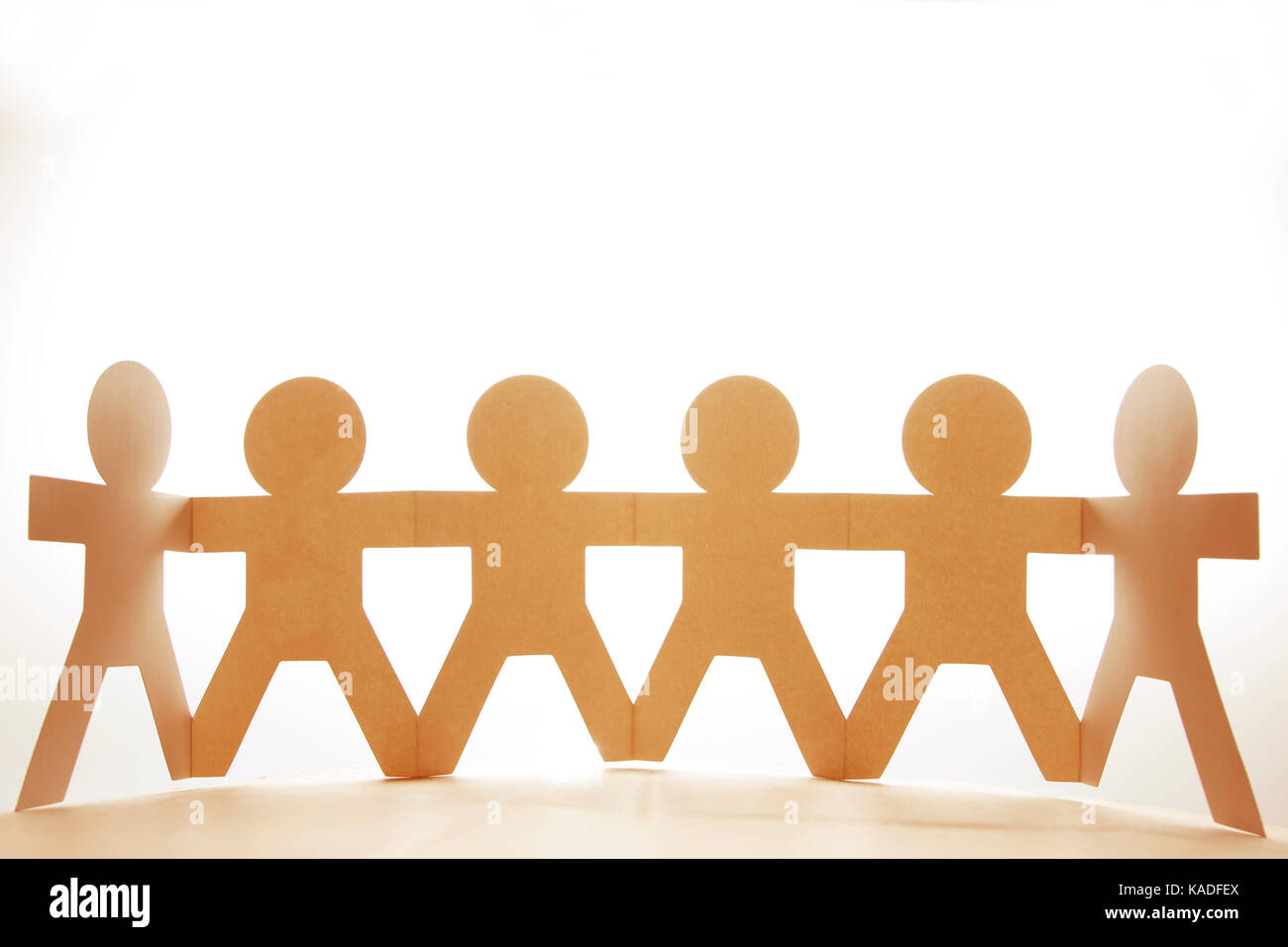 Team of paper chain people Stock Photo - Alamy