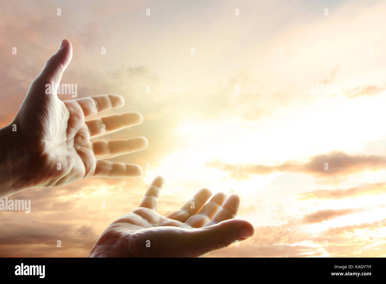 Hands reaching for the sky Stock Photo - Alamy