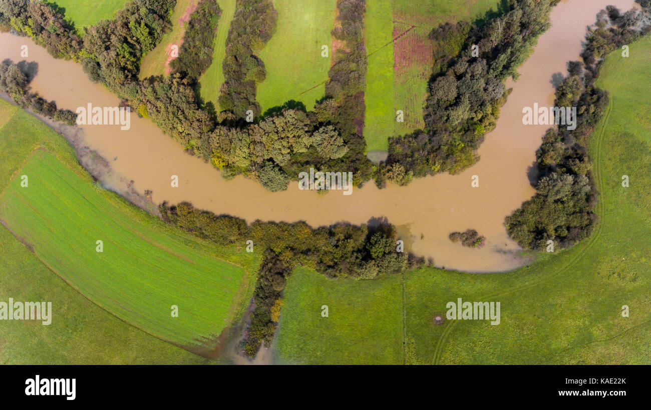 Murky river bend during floods Stock Photo - Alamy