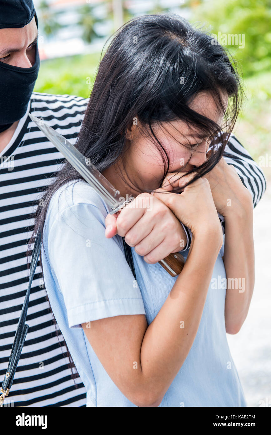 Thief is trying to steal at the public place Stock Photo - Alamy