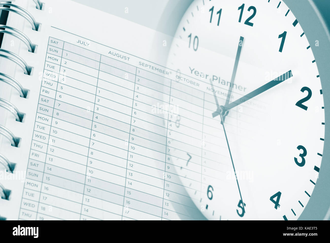 Clock and year planner diary Stock Photo - Alamy