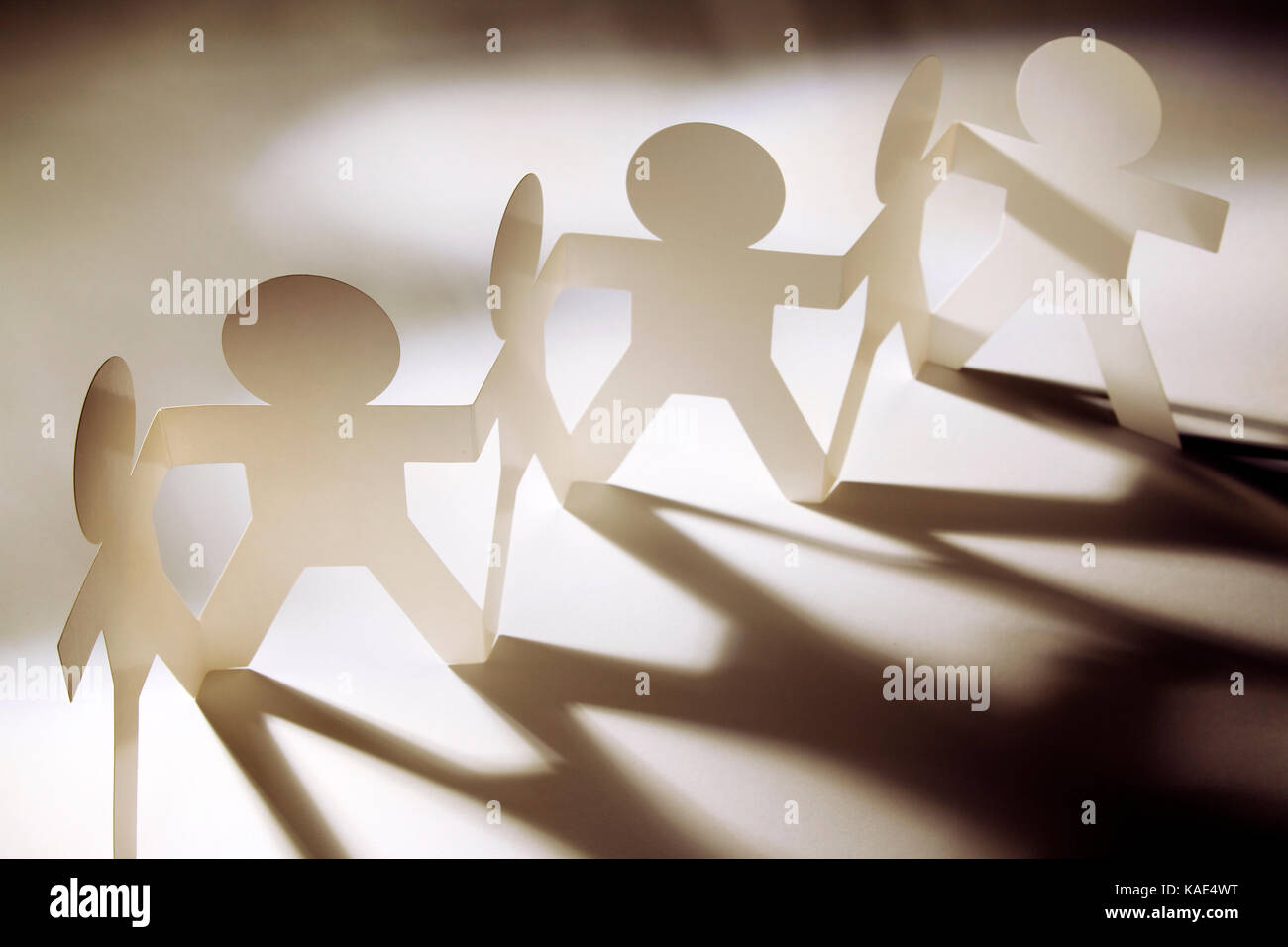 Team of paper chain people Stock Photo - Alamy