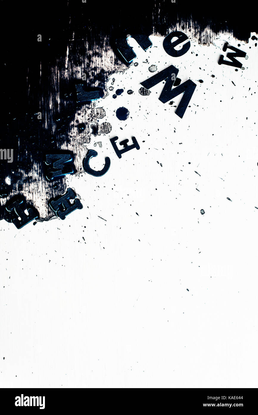 Scattered letters in blurring spilled ink. Creative writing concept ...