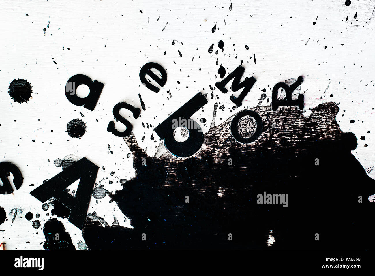Scattered letters in blurring spilled ink. Creative writing concept ...