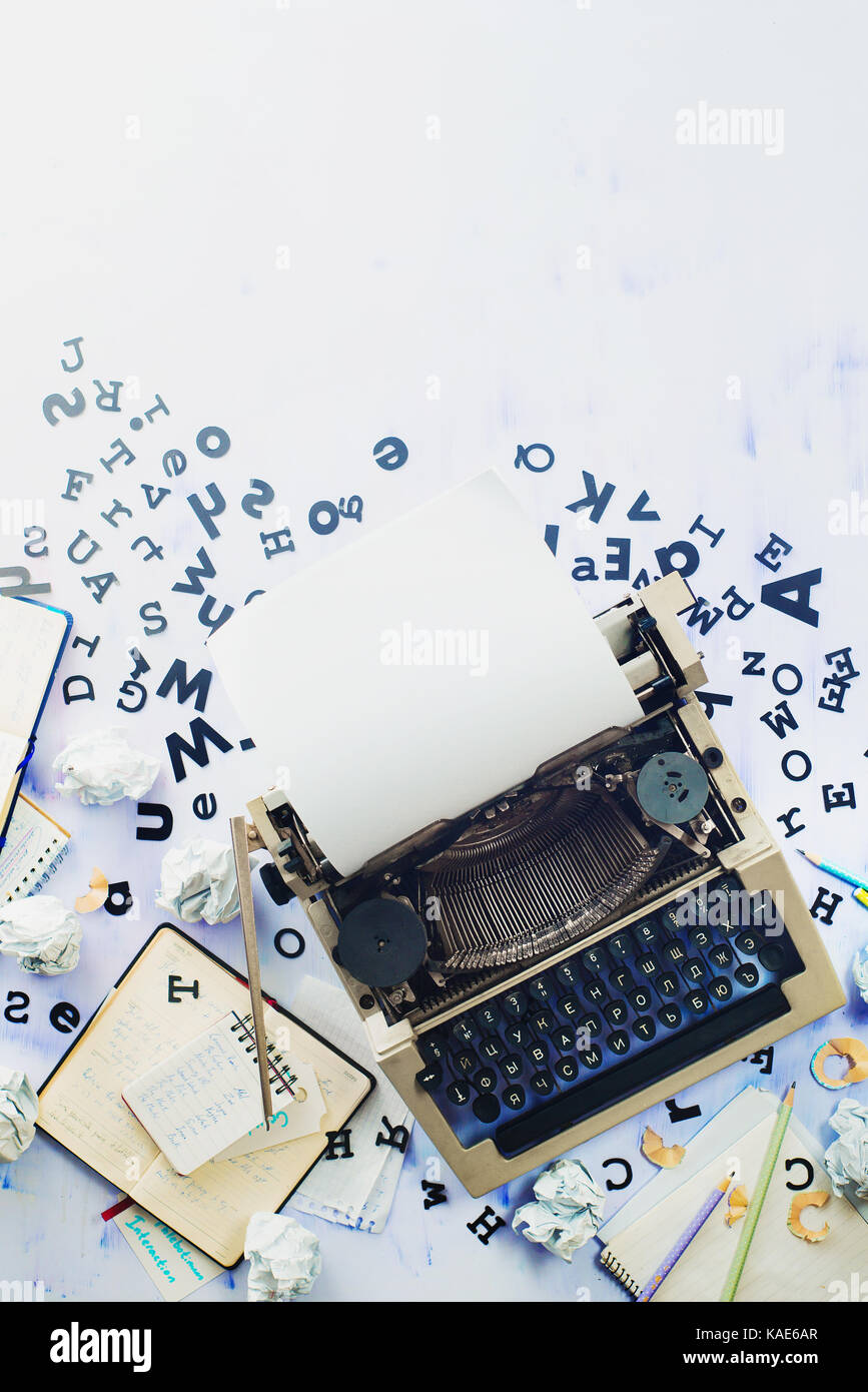 Writer workplace with scattered letters, stationery and a typewriter ...