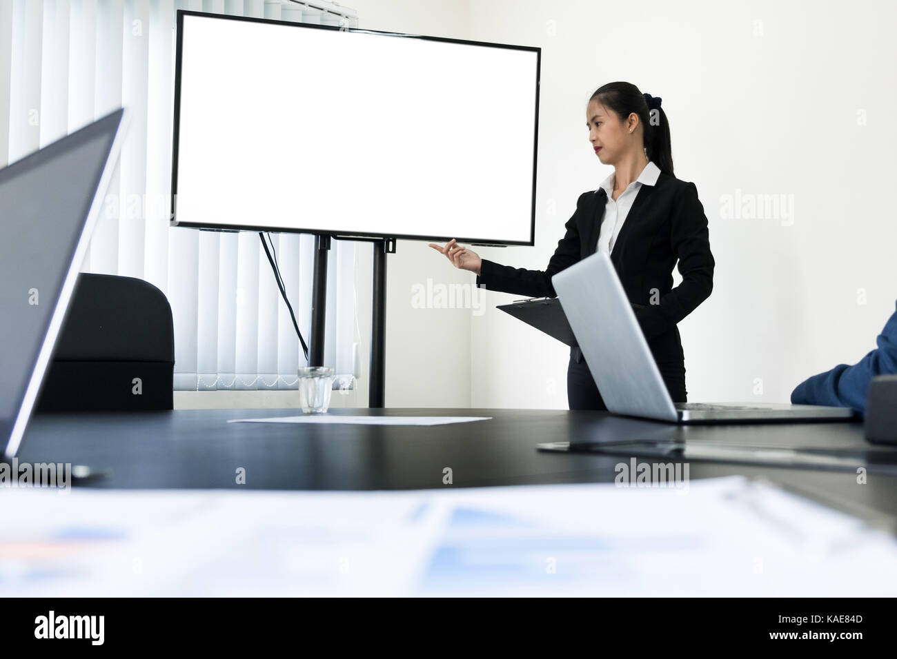 young business man working presentation using television computer of ...